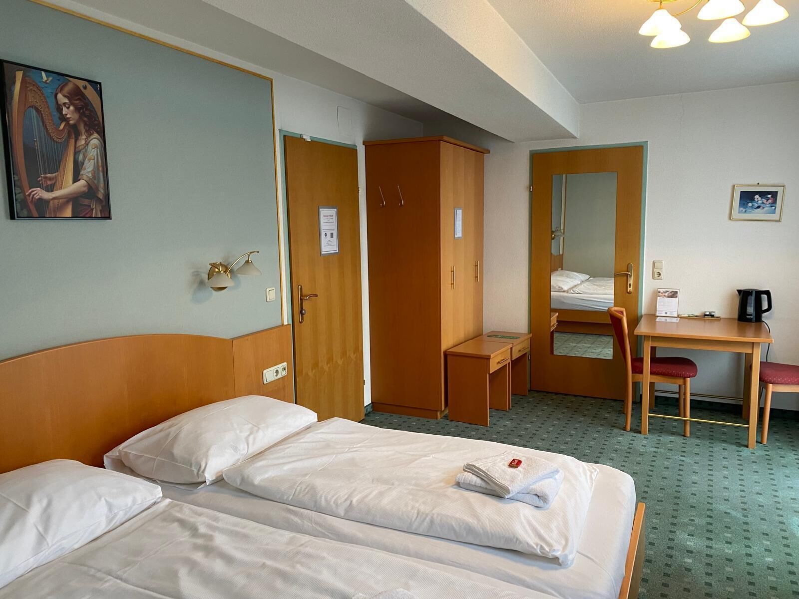 Quarto Comfort, 1 quarto, varanda, vista para o pátio | Quartos insonorizados, roupa de cama fornecida 