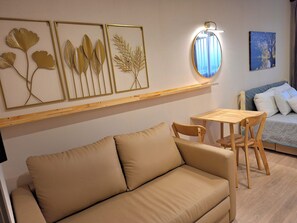 Estúdio, vários quartos, acessível, Vista para a cidade | Sala