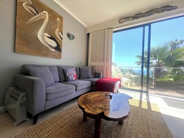 Apartamento Deluxe, varanda, vista para o oceano | Sala de estar