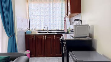 Apartamento luxo, sacada, vista para a cidade | Cozinha privada