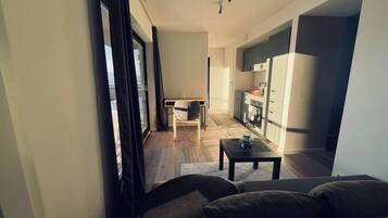Apartamento, 1 quarto, varanda, vista para o jardim | Sala