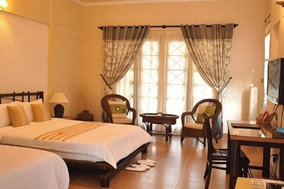 Bangalô, vista para o jardim | Cofres nos quartos, ferros/tábuas de passar roupa
