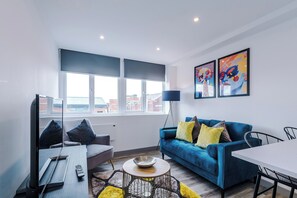 Apartamento família, 2 quartos, para não fumantes | Área de estar