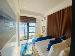 Suíte superior, vista para a praia | Cofres nos quartos, Wi-Fi de cortesia