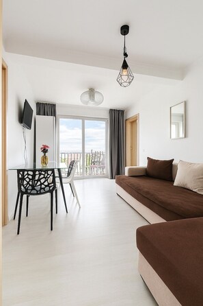 Apartamento Deluxe, varanda, Vista para a cidade | Sala de estar