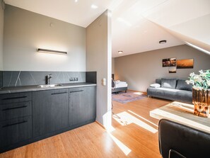 Suíte estúdio conforto | Área de estar