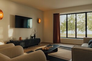 Dúplex, 1 quarto, vista para a baía | Sala de estar