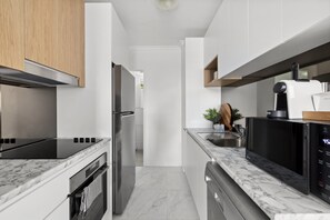 Apartamento | Cozinha privada | Utensílios de cozinha 
