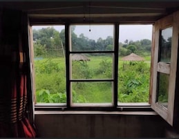 Quarto casal luxo, sacada, vista para o jardim | Vista do quarto