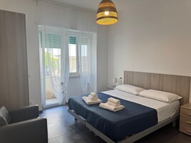 Quarto casal ou duplo básico, sacada