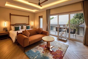 Suite, varanda | Roupa de alta qualidade, minibar, cofre no quarto 