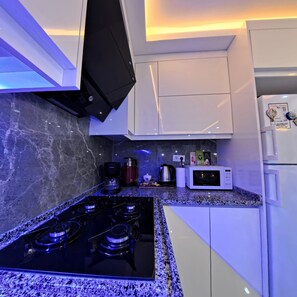 Apartamento Familiar em Condomínio Fechado, varanda, Vista para a cidade | Cozinha privada | Uma cafeteira/bule 