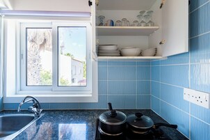 Apartamento, 1 cama de casal e sofá-cama, sacada, vista para a cidade | Cozinha americana privada | Geladeira grande, micro-ondas, cooktop, máquina de café expresso