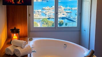 Suite, vista para o mar | Cortinas/cortinados opacos, ferro/tábua de engomar