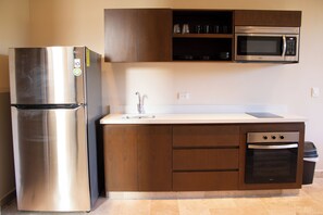 Apartamento luxo, sacada, vista para o jardim | Cozinha privada