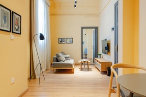 Apartamento standard, 1 quarto | Área de estar