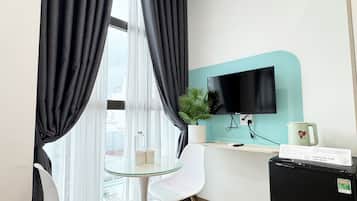 Suite Deluxe, varanda, Vista para a cidade | Televisão