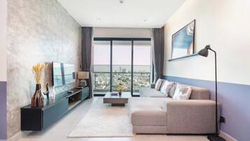 Suite Presidencial, 2 quartos, acesso ao Club Lounge, Vista para a cidade | Sala de estar | Smart TV de 65 de polegadas com canais por cabo, lareira, Netflix