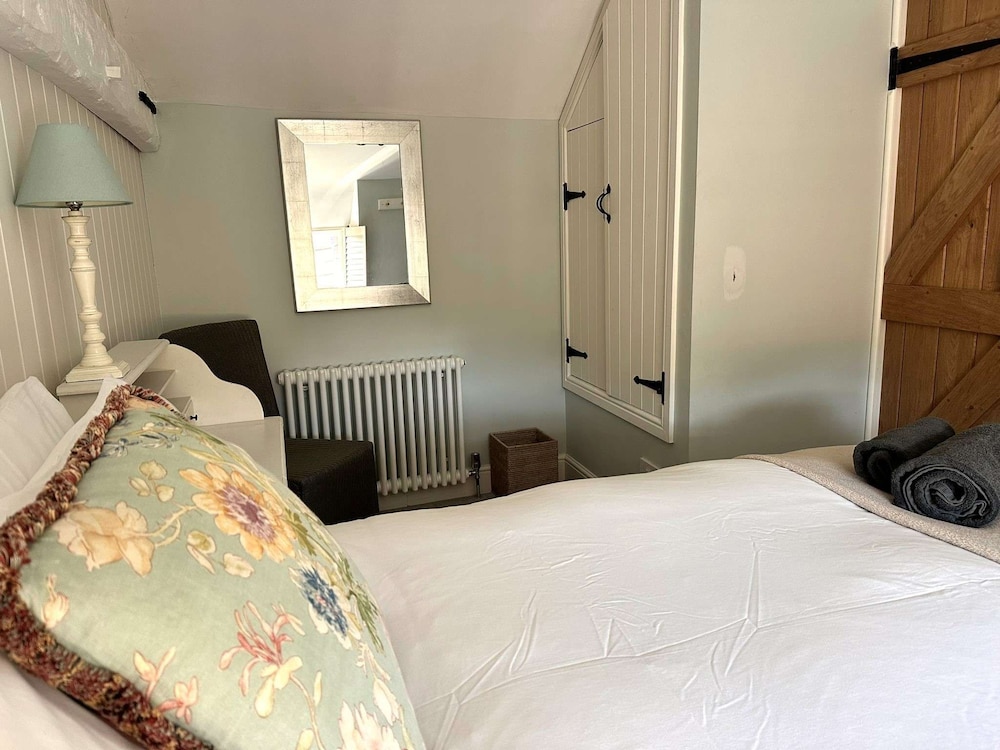 Well Cottage is a refurbed flint cottage with views across the marshes ...