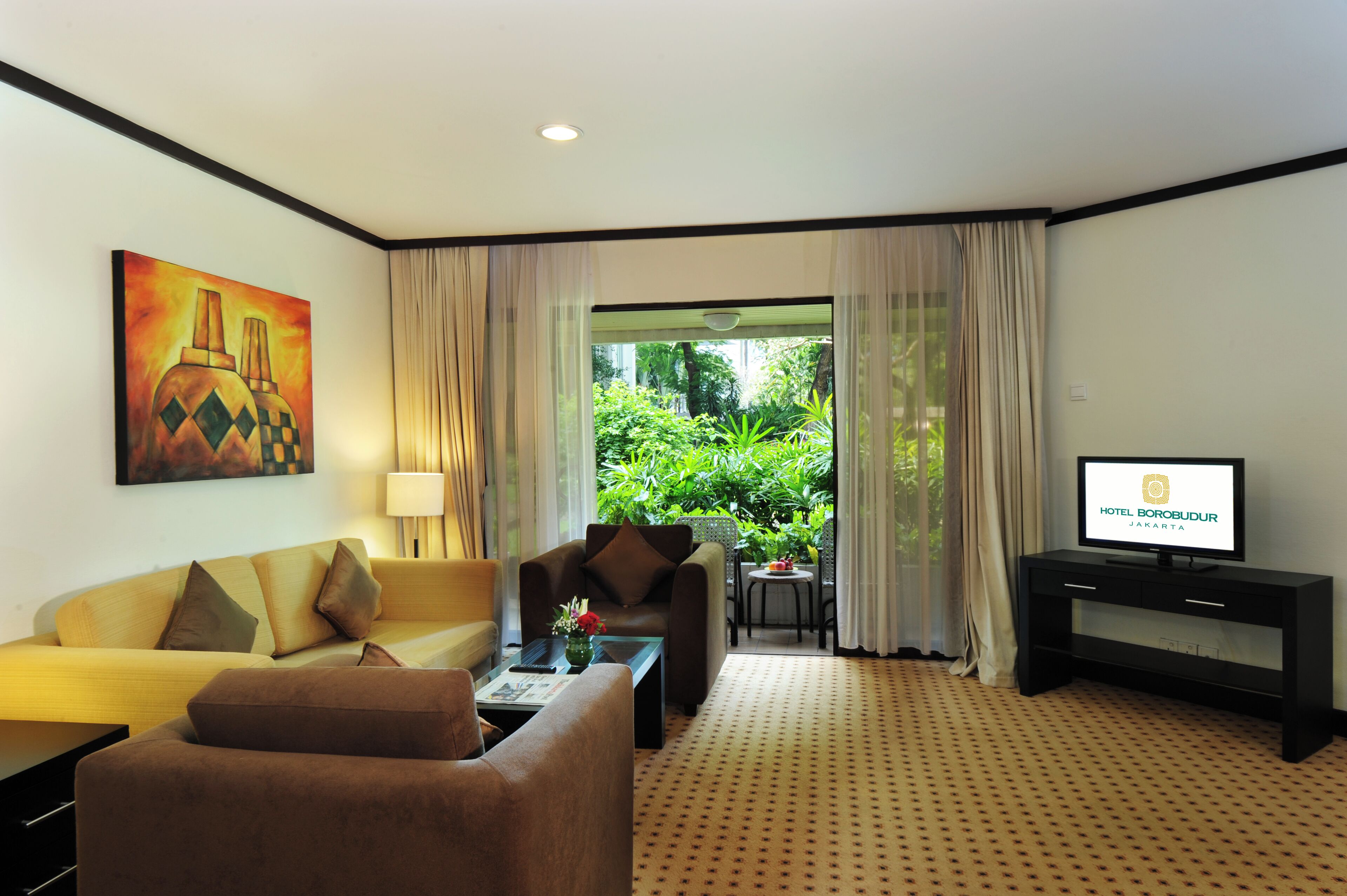 Apartamento família, sacada, vista para o parque | Área de estar