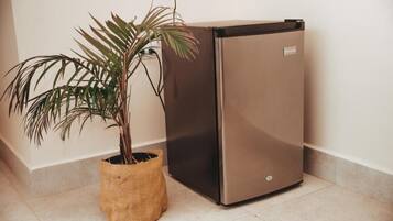 Suíte, vista para a piscina | Área de estar