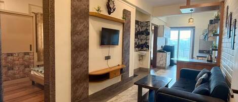Apartamento luxo, 2 quartos | Área de estar