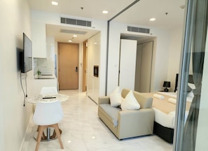 Apartamento, 1 quarto, acessível, piscina particular | Sala de estar