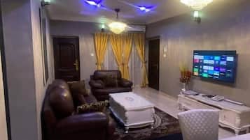 Apartamento Deluxe, Vista para a cidade | Sala de estar