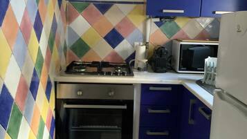 Casa família, 1 cama Queen, varanda | Cozinha privada