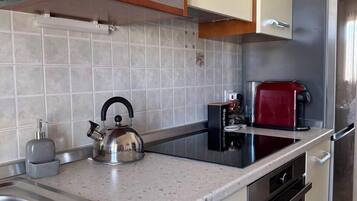 Apartamento Comfort em Condomínio Fechado, vista para o mar | Cozinha privada