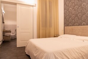 Apartamento conforto | Cortinas blackout, ferros/tábuas de passar roupa, Wi-Fi de cortesia