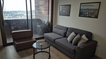 Apartamento conforto, sacada | Área de estar