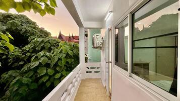 Quarto casal superior, vista para a cidade | Terraço/pátio