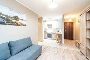 Apartamento | Sala de estar | TV de tela plana 37 polegadas com canais a cabo