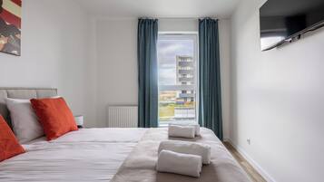 Apartamento Familiar, varanda | Cortinas/cortinados opacos, ferro/tábua de engomar, Wi-fi grátis