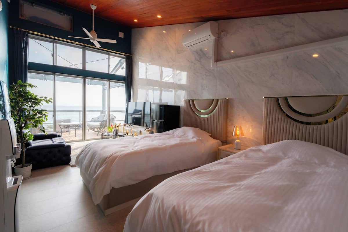 Quarto Twin Deluxe, 2 camas individuais, varanda, vista para o oceano | Wi-fi grátis