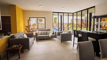 Casa de Campo Familiar, vista para o jardim | Sala de estar