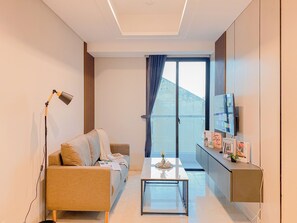 Apartamento standard, 2 quartos | Área de estar