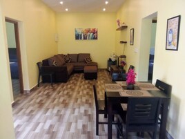 Quarto casal | Área de estar | TV