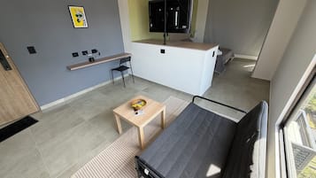 Estúdio básico, vista para a cidade | Área de estar | Smart TV 32 polegadas com canais digitais