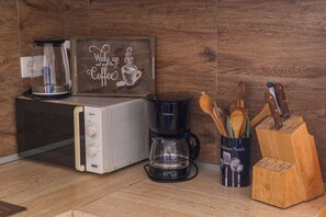 Apartamento (A3) | Cozinha privada | Geladeira, micro-ondas, fogão, cooktop