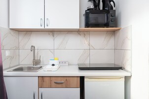 Estúdio (A2) | Cozinha privada | Frigobar, cooktop, máquina de café expresso, chaleira elétrica