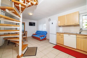 Apartamento (A4) | Cozinha privada | Geladeira, micro-ondas, fogão, cooktop