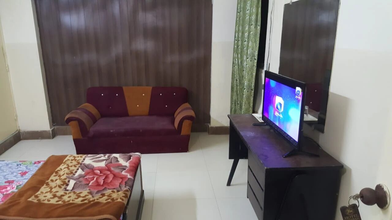 Quarto Duplo Deluxe, Vista para a cidade | Sala de estar