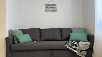 Apartamento Estudio 9 | Cofre no quarto, cortinas/cortinados opacos, ferro/tábua de engomar