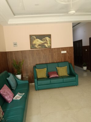 Apartamento família, sacada | Área de estar