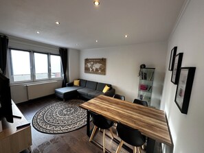 Apartamento Comfort, vista para o jardim | Sala de estar