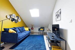 Apartamento superior, cozinha | Área de estar