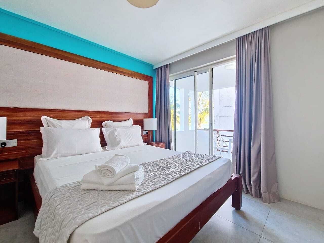 Apartamento Comfort, varanda, vista para o mar | Cofre no quarto, cortinas/cortinados opacos, Wi-fi grátis 