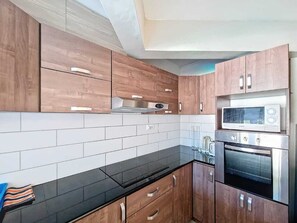 Apartamento Comfort, varanda, vista para o mar | Cozinha privada